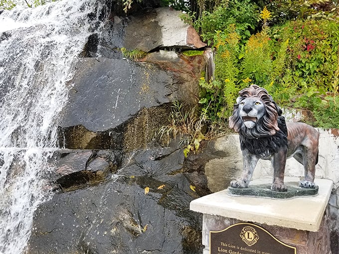 A noble bronze lion stands sentinel by the falls, looking like he's thinking, "Yes, I know I've got the best office view in Wisconsin."
