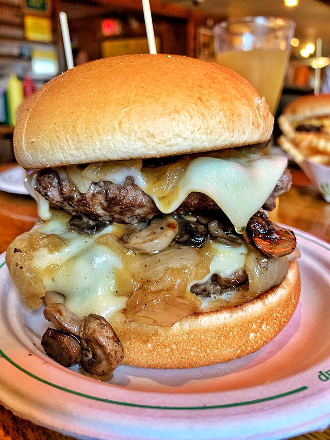 Behold the Mushroom Swiss in all its glory! Melted cheese cascades over saut&eacute;ed mushrooms and a perfectly seasoned patty.