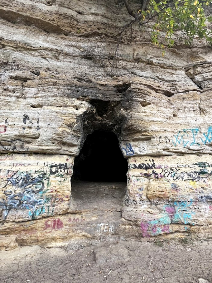 The humble cave entrance belies the vibrant interior within &ndash; like finding an art museum where you least expected it.