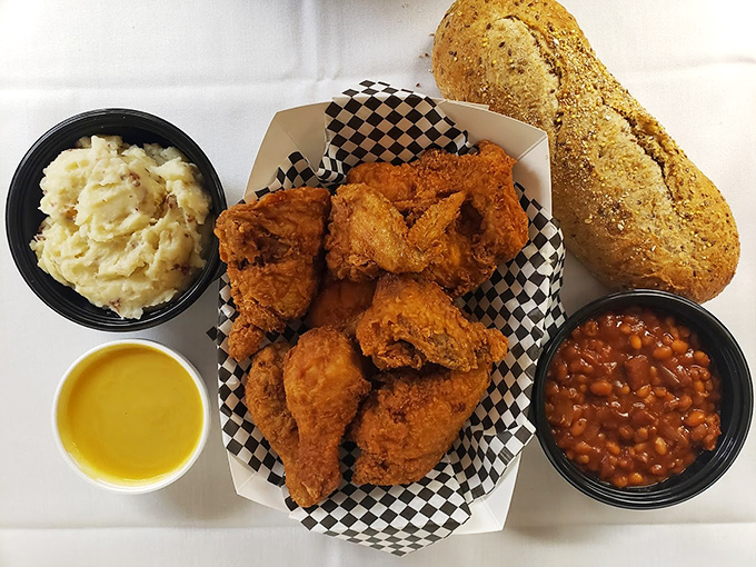 Golden-fried chicken that would make your grandmother jealous, served with creamy mashed potatoes and savory baked beans.