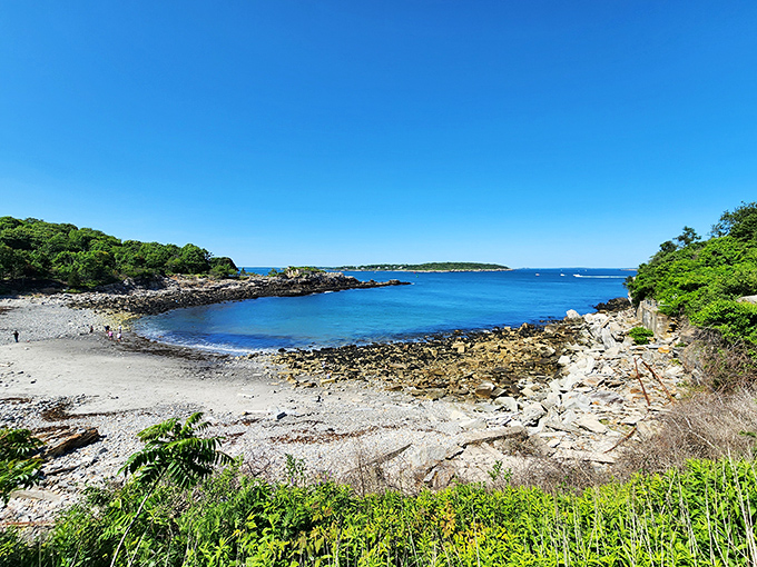 Nature's perfect combination: rocky outcroppings, sandy patches, and crystal-clear waters create Maine's signature coastal cocktail.