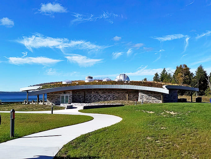 The Headlands' visitor center blends harmoniously with its surroundings, its green roof and observatory dome ready for stargazing adventures.