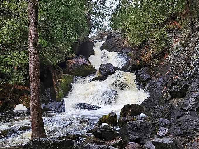 Long Slide Falls races down 50 feet of dramatic red rock formations, creating a natural water show that never stops.