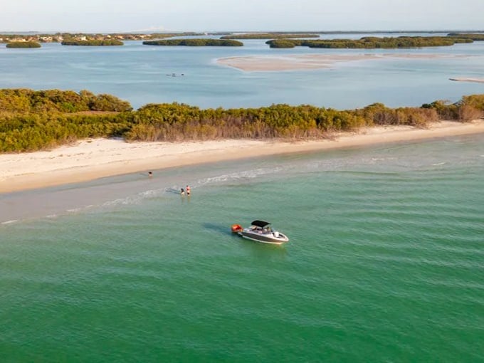 Shell Key Preserve's wooden docks invite exploration of pristine waters where boats barely disturb the surface.