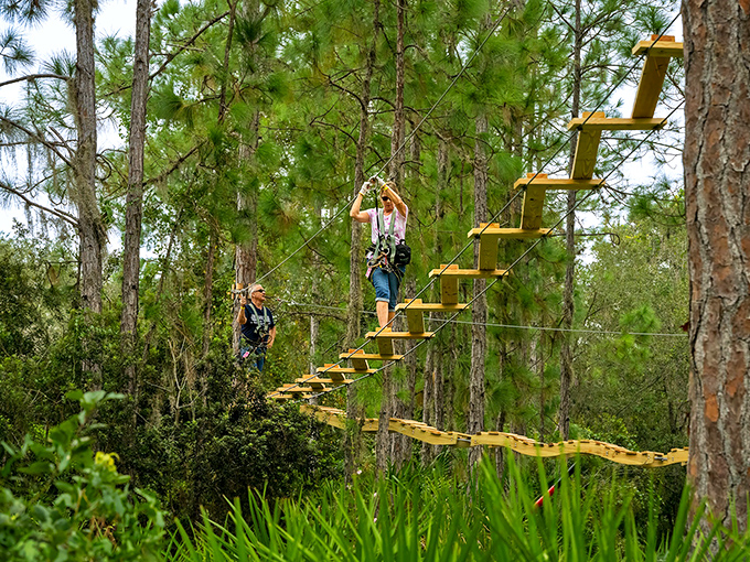 At TreeUmph! Adventure Course, this challenging aerial bridge tests your balance and courage as you navigate between platforms high above the forest floor.