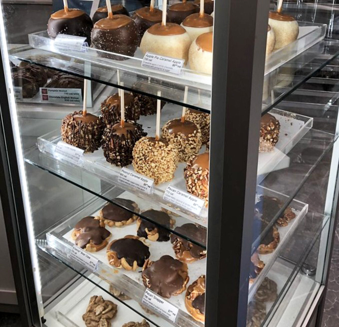 Caramel apples and chocolate-dipped treats stand at attention in Kilwins' display case, each one hand-decorated and impossibly tempting.