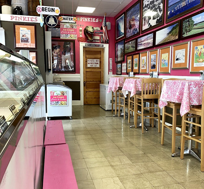 The interior of Pinkie's bursts with personality, from pink walls covered in memorabilia to cozy tables where ice cream dreams come true.
