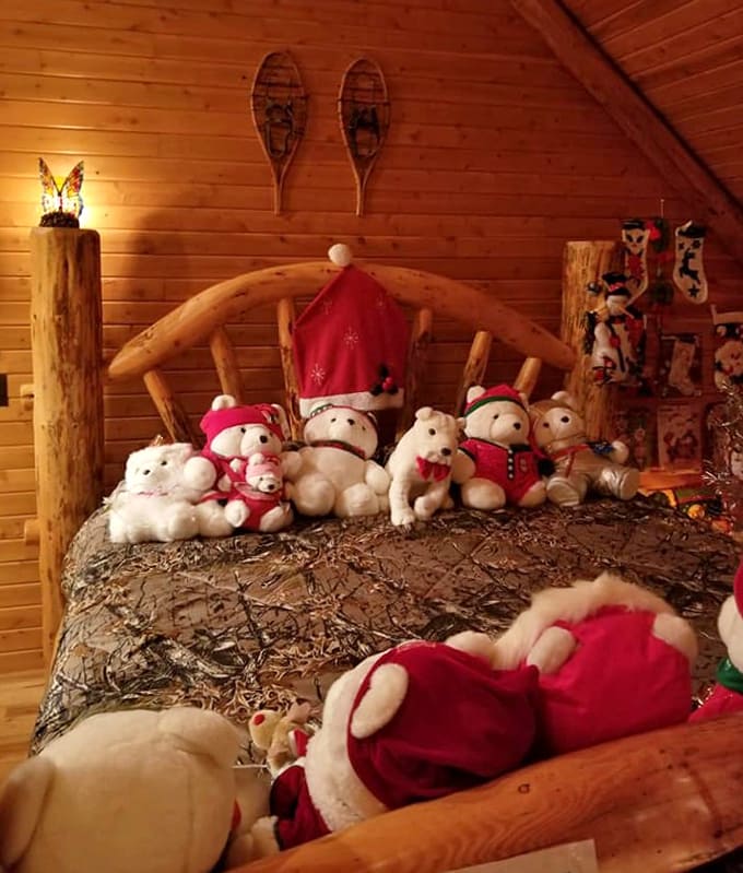 The teddy bears' Christmas sleepover is in full swing on this rustic log bed. No one's getting coal in their stocking here!