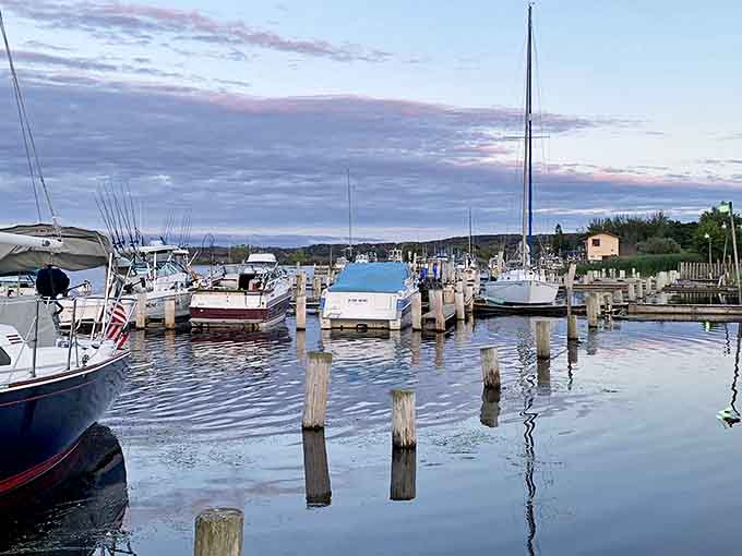 Betsie Bay Marina's boats stand ready for adventure, their masts reaching skyward like exclamation points on Michigan's watery playground.