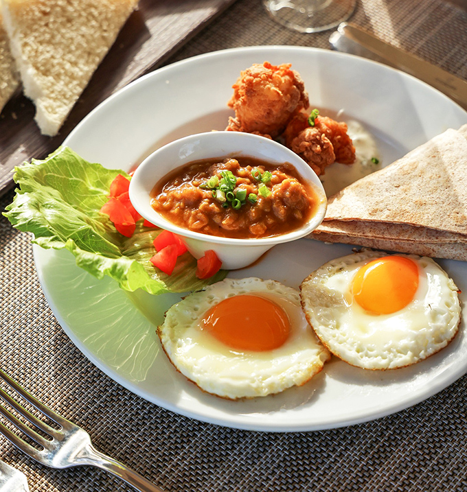 Breakfast of champions! Those sunny-side-up eggs are practically winking at you, saying "Go ahead, we won't tell about your second plate."
