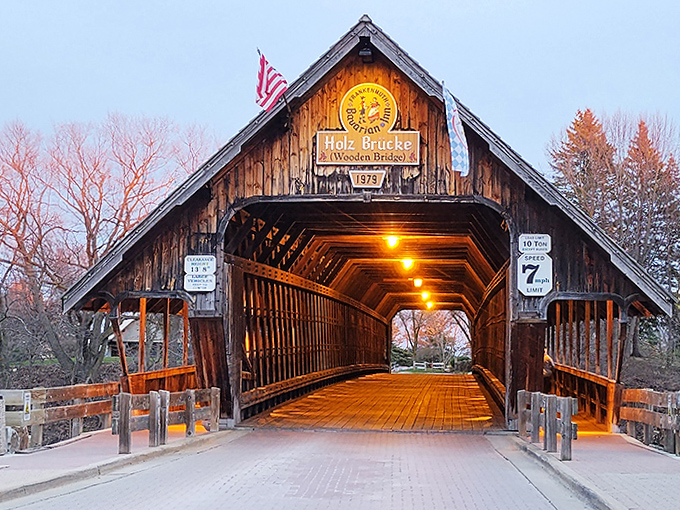 Evening illumination turns the interior into a warm, inviting passage that feels like walking through the ribcage of a friendly wooden giant. 