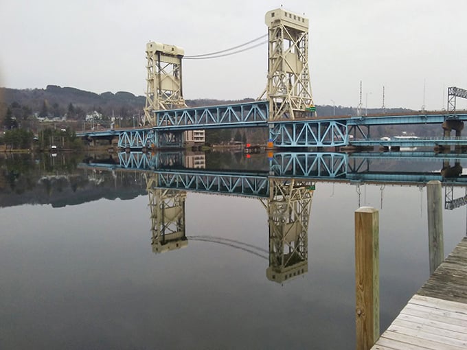 The iconic Portage Lake Lift Bridge connects sister cities Hancock and Houghton, its blue steel frame creating a perfect reflection that locals never tire of admiring.
