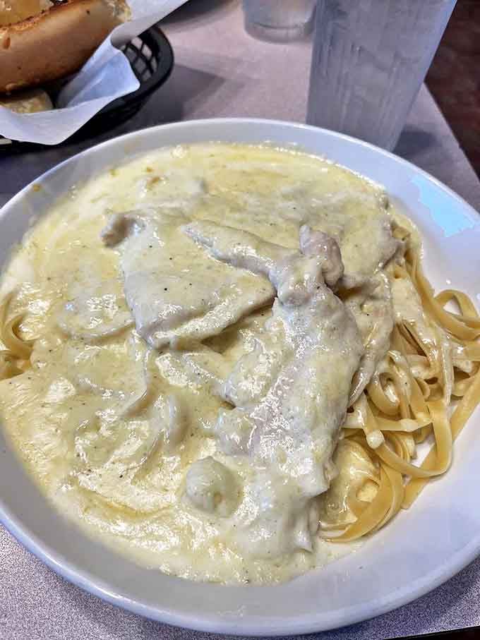 Chicken Alfredo: Tender chicken nestled in a sauce so velvety it should be illegal. The kind of dish that makes you close your eyes with each bite.