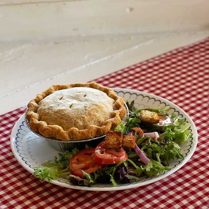 This isn't just any chicken pot pie &ndash; it's comfort in a tin, with a golden-brown crust that crackles like autumn leaves and a filling that tastes like childhood memories.