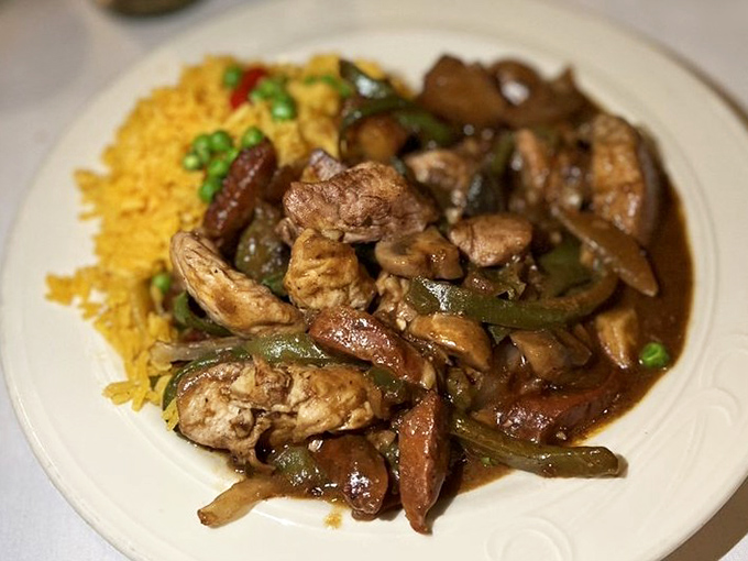 The Chicken Salteado brings together tender chunks of chicken with peppers and onions in a dance of flavors.