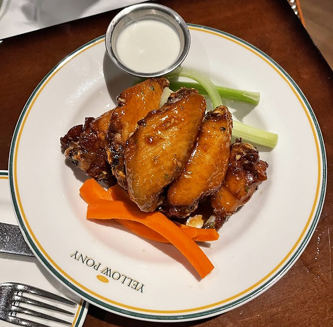 Perfectly glazed chicken wings that make you wonder if the chef has somehow discovered the secret to making vegetables obsolete.