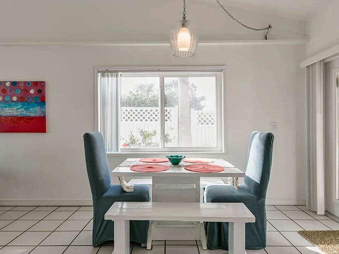 The dining area offers intimate seating where every meal feels special, even if it's just cereal and coffee.