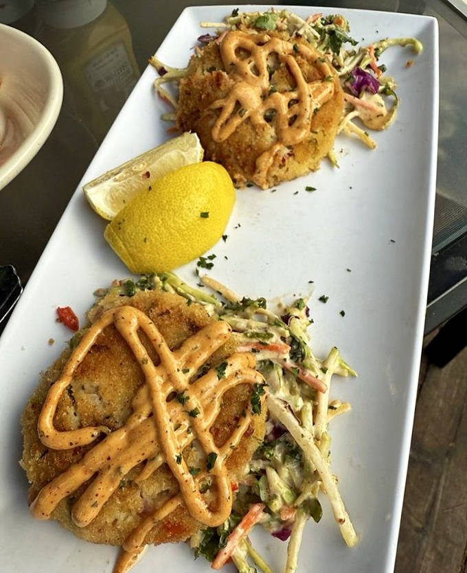 Crispy golden schnitzel drizzled with sauce and paired with fresh slaw &ndash; a plate that whispers "Ja, this is the real deal" with every bite.