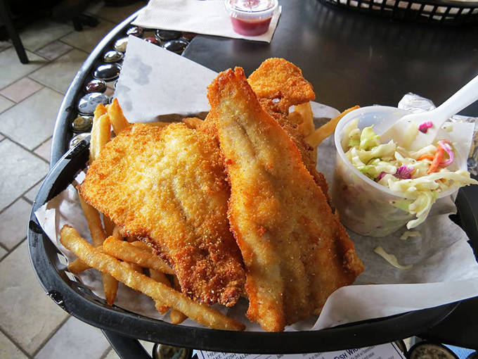 Each piece of fried white fish breaks apart with gentle pressure, revealing pearly flesh that practically melts on your tongue.