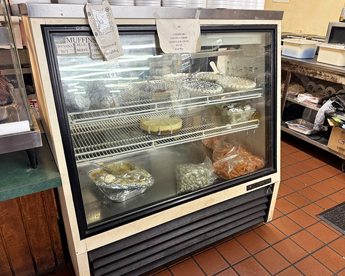 The pastry case showcases circular masterpieces that would make your grandmother both proud and a little jealous of their perfect crusts.