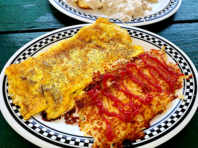 An omelet that's seen more fillings than a dentist's office, paired with hash browns crisped to perfection.