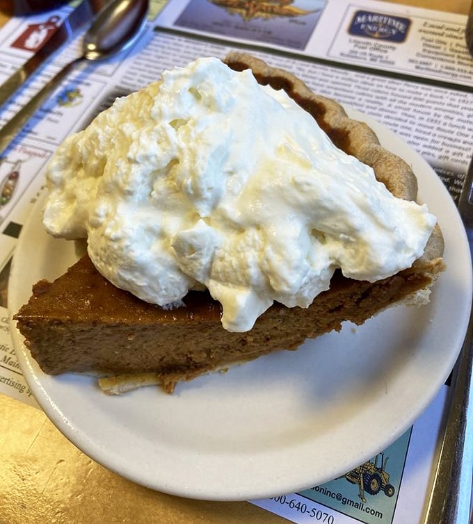 Pumpkin pie that refuses to be seasonal &ndash; silky, perfectly spiced custard in a flaky shell, topped with a cloud of real whipped cream.