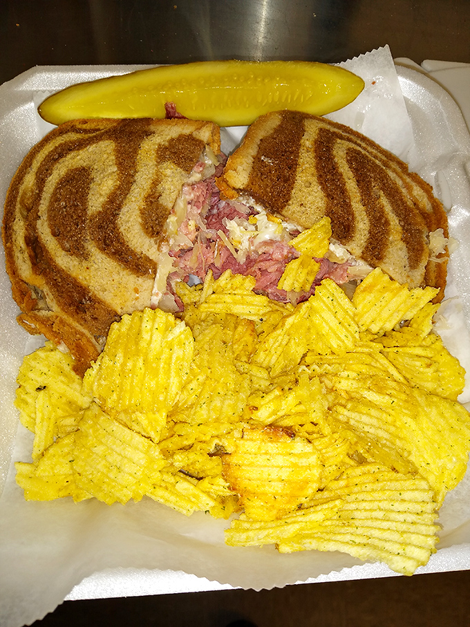 The Reuben sandwich arrives on marbled rye with a mountain of corned beef that would make a New York deli nod in approval.