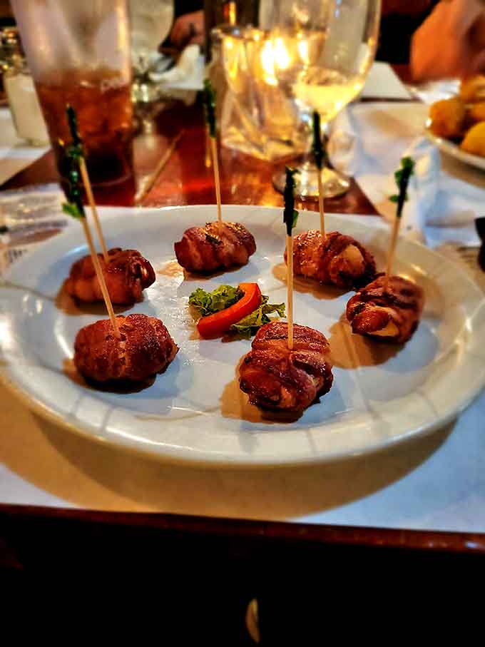 Bacon-wrapped bites of heaven arrive on wooden skewers &ndash; these little flavor bombs might be the best first date ice-breaker ever invented.