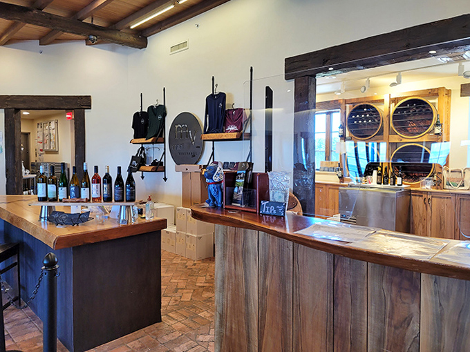 The tasting room blends rustic warmth with contemporary elegance, where wooden accents and thoughtful displays invite visitors to explore Michigan's unexpected wine treasures.