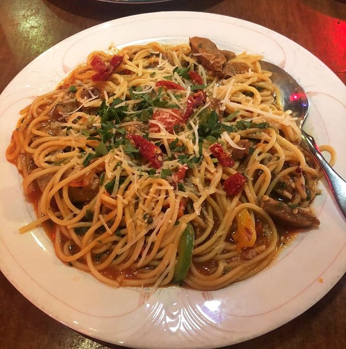 Spaghetti mingles with tender meat and colorful peppers in a sauce worth committing minor crimes for.