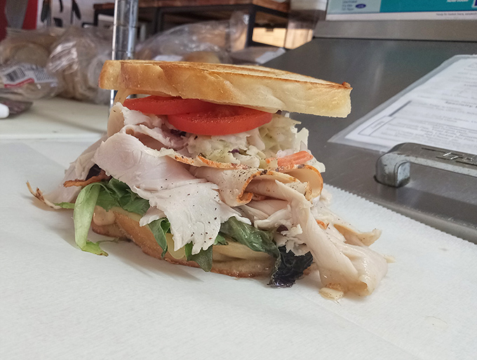 The turkey club isn't just a sandwich, it's architecture &ndash; layers of roasted turkey, garden-fresh veggies, and just the right amount of mayo between perfectly toasted bread.