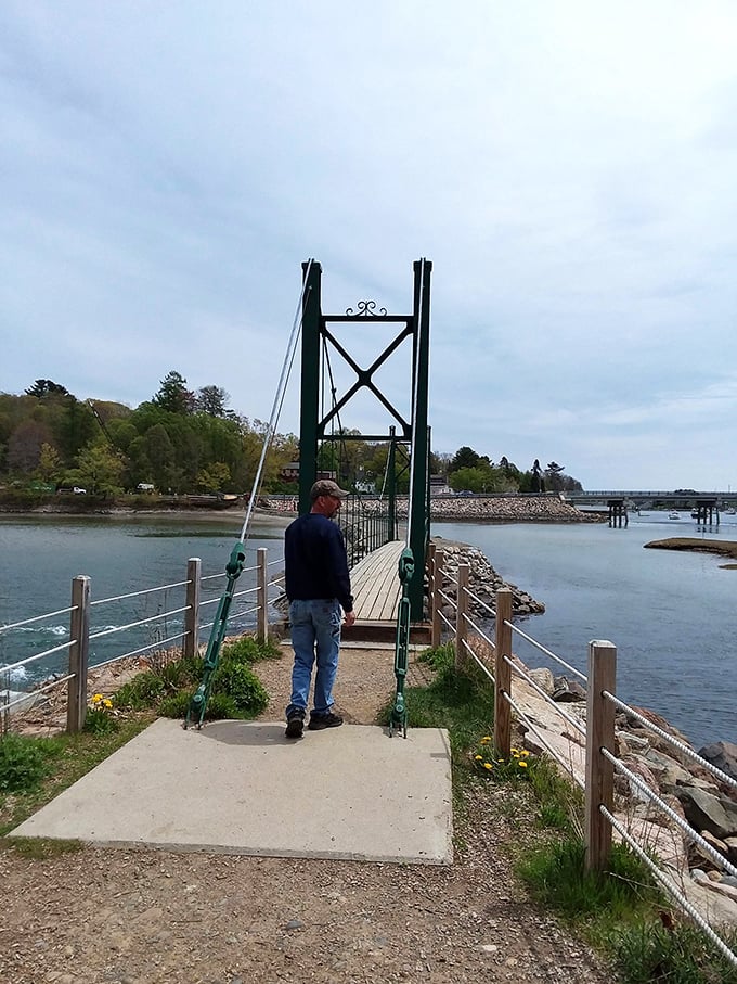 The iconic Wiggly Bridge stands ready for adventure, its simple design belying the joy of its gentle bounce underfoot.