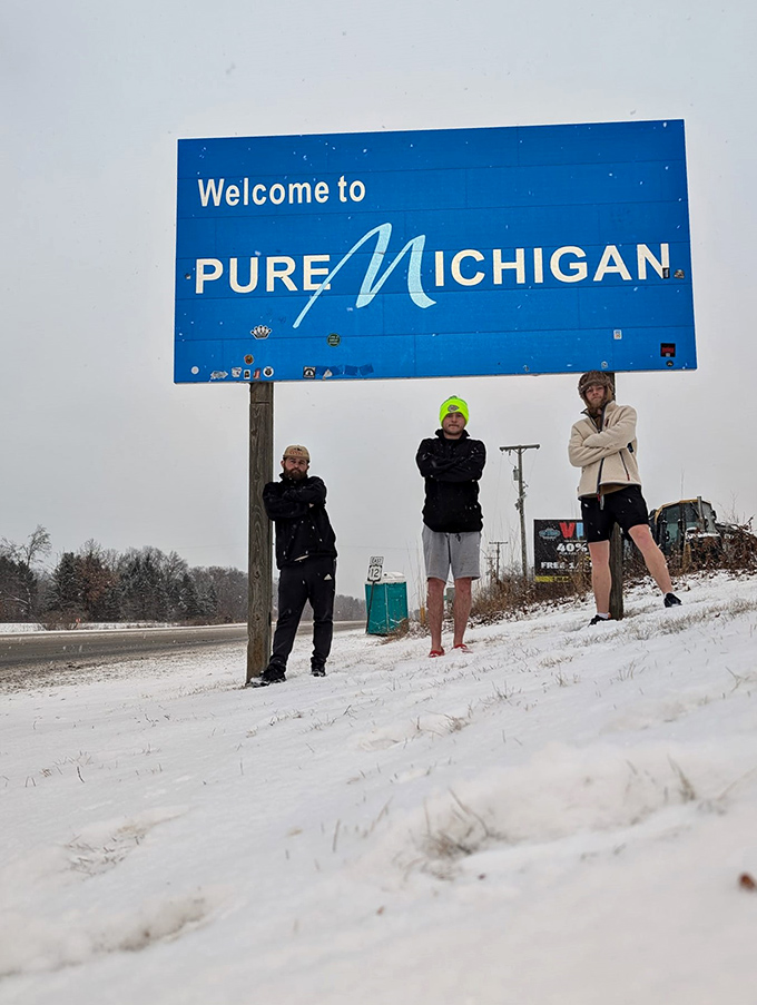 Even in winter's embrace, Michigan's welcome signs draw determined pilgrims who brave the cold for that perfect photo opportunity.