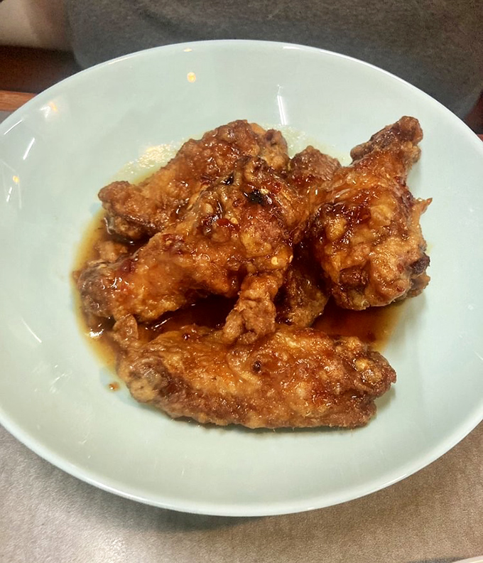 These Korean-style wings glisten with sweet-spicy sauce, promising a flavor explosion that'll have you licking your fingers shamelessly.