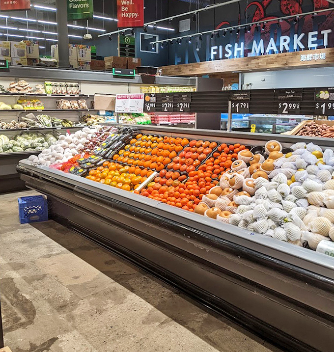 A colorful battalion of fruits stands at attention, from familiar oranges to exotic Asian varieties that rarely make appearances in conventional grocery stores.