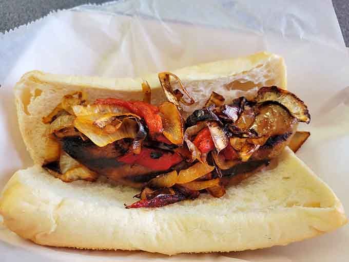 The Italian sausage with peppers and onions proves that sometimes the best relationships involve grilled vegetables and perfectly seasoned meat living harmoniously in bread.