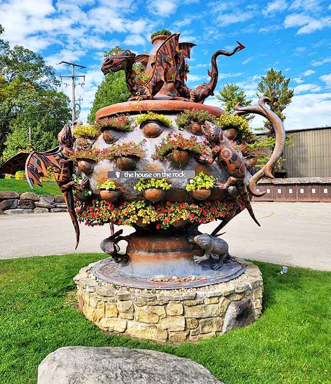 This isn't your garden-variety sculpture &ndash; it's a metal fever dream blooming with real flowers, part machine, part botanical wonder.