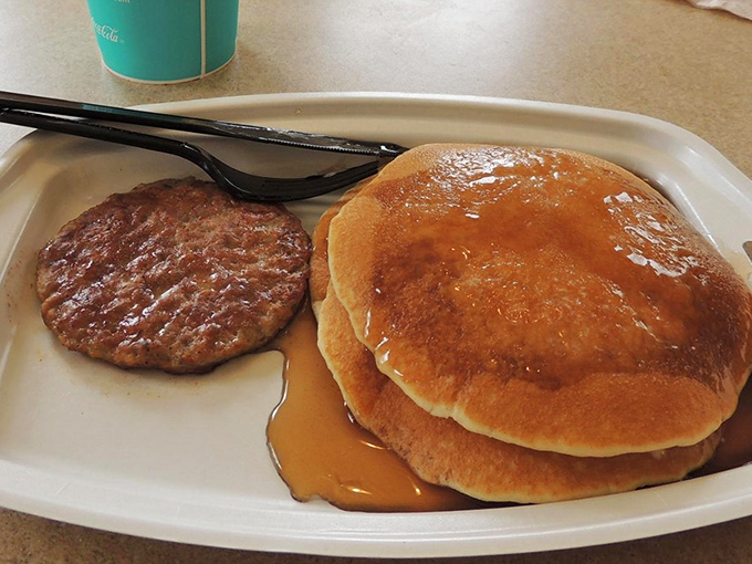Breakfast with a side of elegance: Pancakes and sausage served on real plates feel somehow more sophisticated in this historical setting.