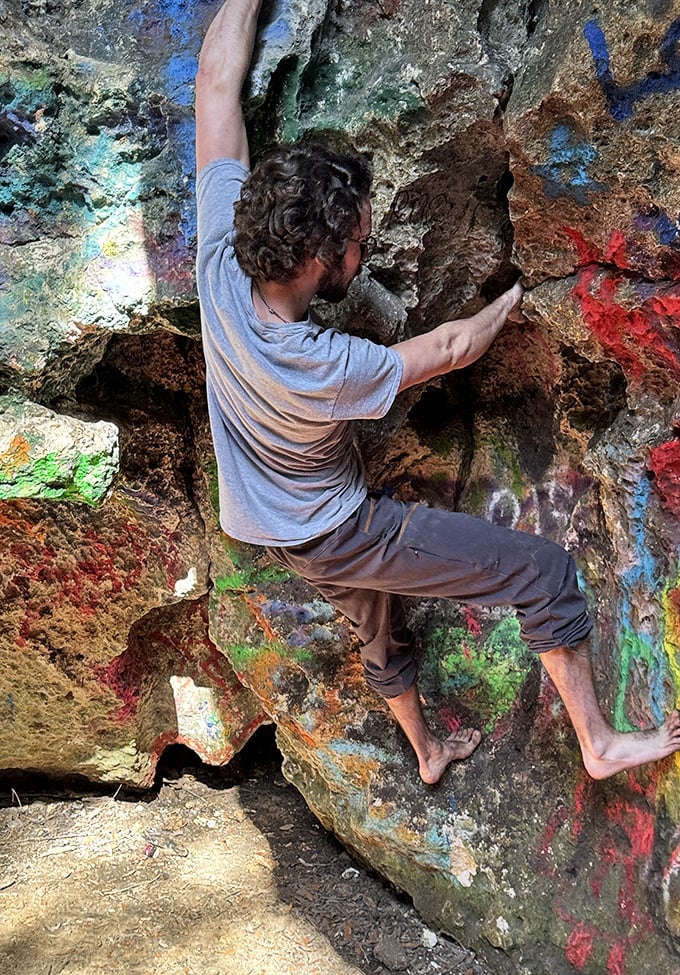 Nature's climbing wall: Barefoot adventurers test their skills on the textured cave walls, finding natural handholds in the limestone.