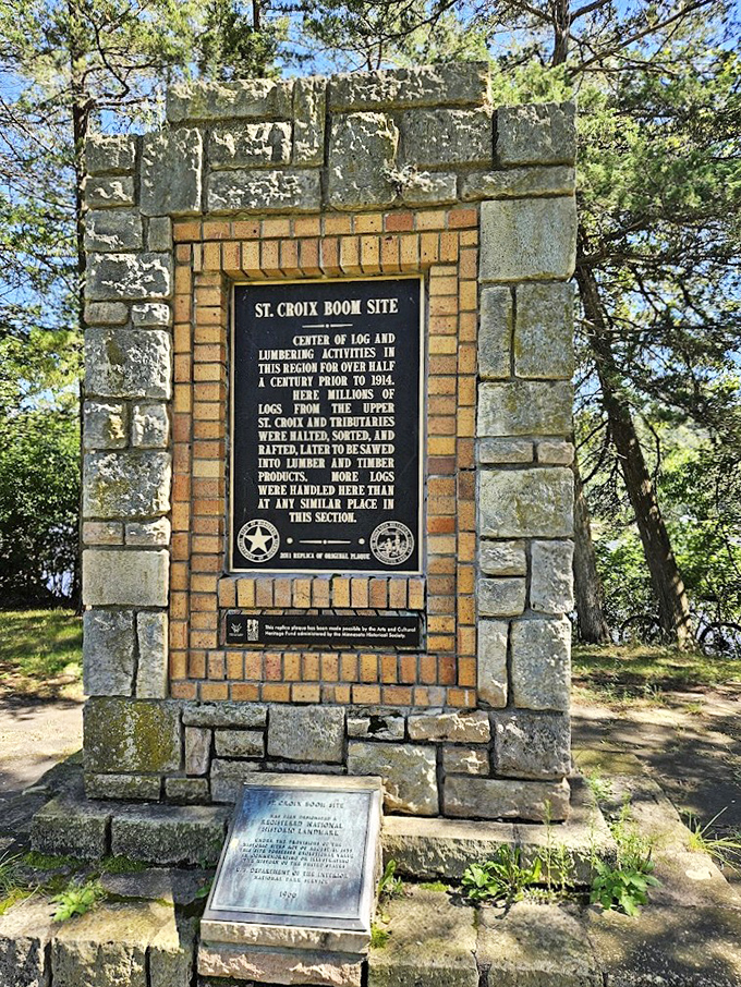This stone monument stands sentinel, silently telling tales of the logging boom that once made this river the highway of industry.