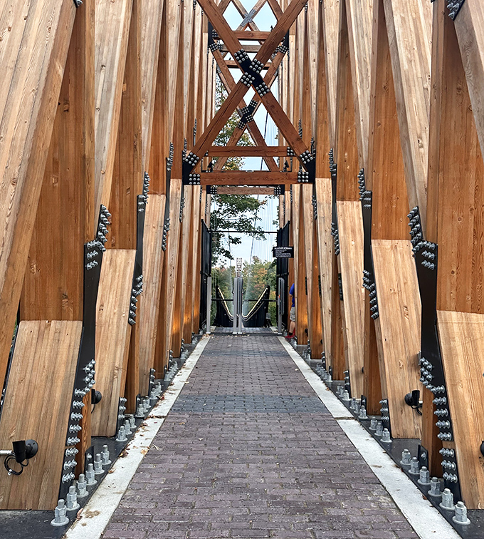 The wooden walkway creates a striking contrast against the industrial framework&mdash;nature and engineering in perfect harmony.