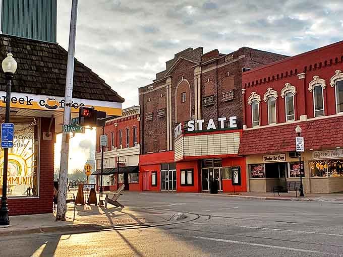 The historic State Theater marquee lights up downtown Alpena, promising entertainment and adding vintage charm to the evening streetscape.
