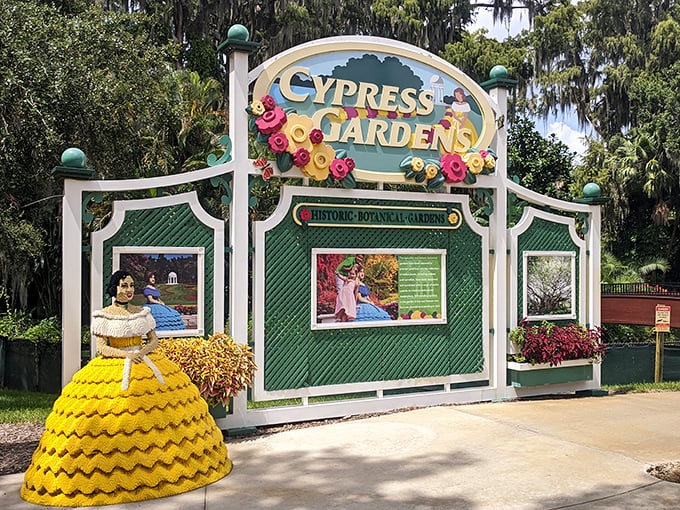 The whimsical entrance to Cypress Gardens welcomes visitors with colorful flowers and a nod to its storied past as one of Florida's first tourist attractions.