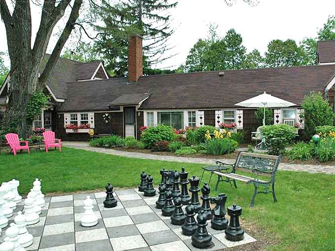 Giant chess pieces stand ready for strategic battles on the lawn of Lazy Cloud B&B, where garden games take on storybook proportions.