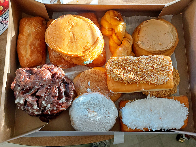 Donut artistry on display! Donna's selection showcases traditional favorites alongside specialty creations that keep customers coming back.