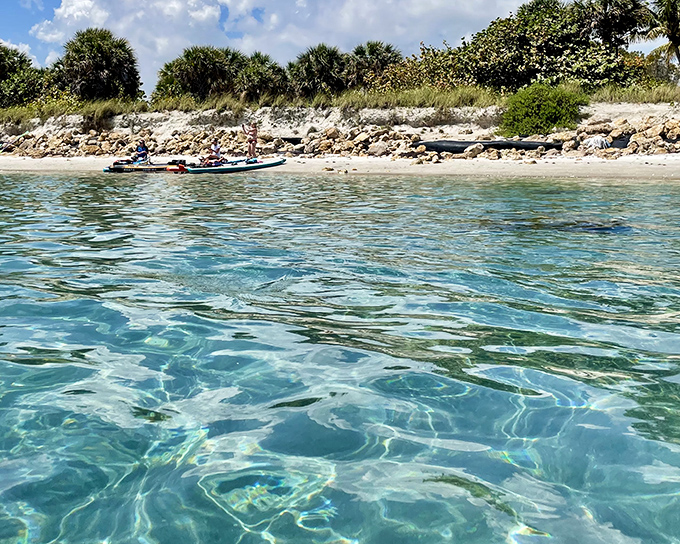 Boaters anchor offshore at Keewaydin Island, creating a floating community of beach lovers in the know.