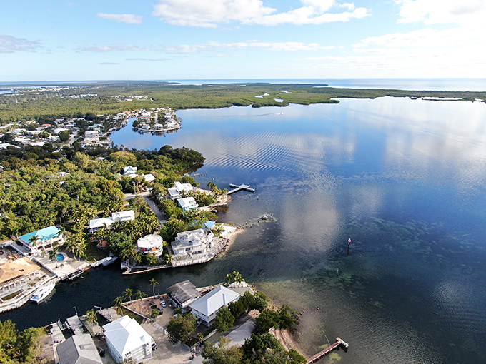 From above, Key Largo reveals its true character: a patchwork of turquoise waters, lush greenery, and homes built for sunset-watching.