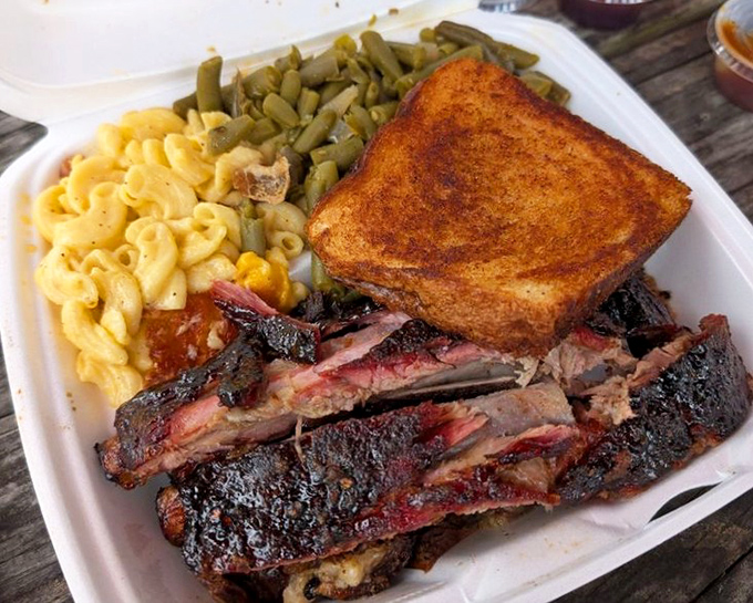 Smoke ring perfection on display &ndash; these ribs offer that magical balance between tender meat and flavorful bark that BBQ dreams are made of.