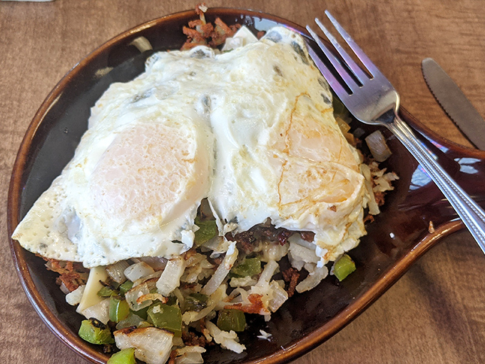 A breakfast skillet that means business: crispy potatoes, savory meats, and eggs that create the morning fuel you didn't know you needed.