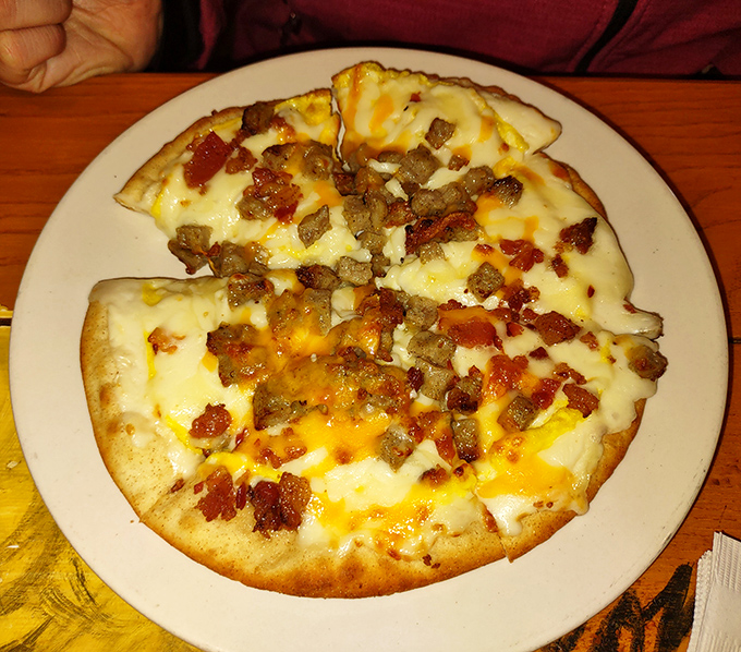 Breakfast pizza that defies convention – melty cheese, savory toppings, and a perfectly crisp crust. Who says pizza can't be breakfast?